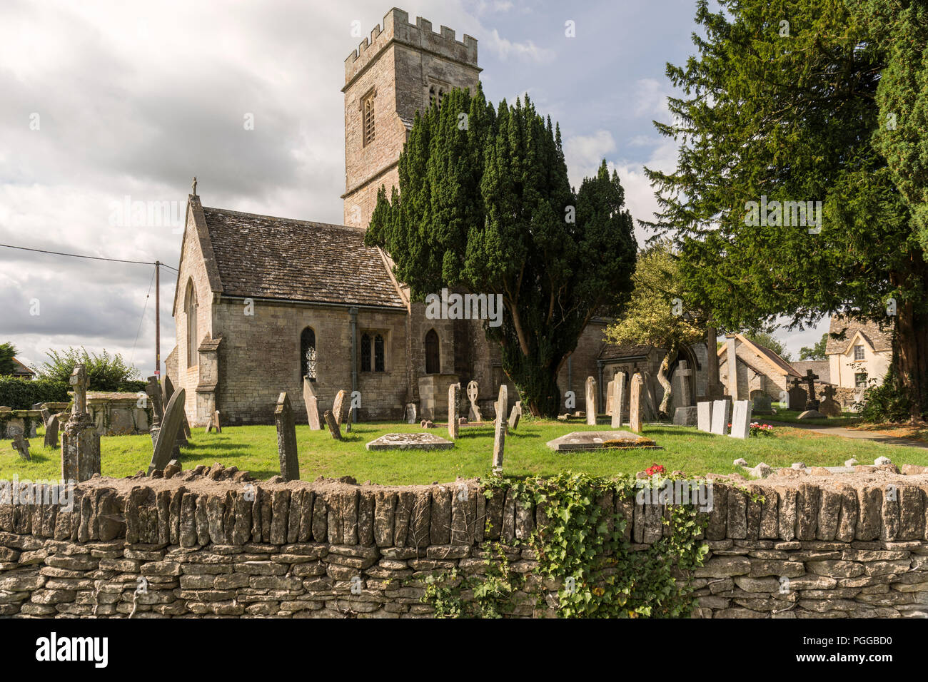 All Saint's Church and gravestones, Littleton Drew, Wiltshire, England ...