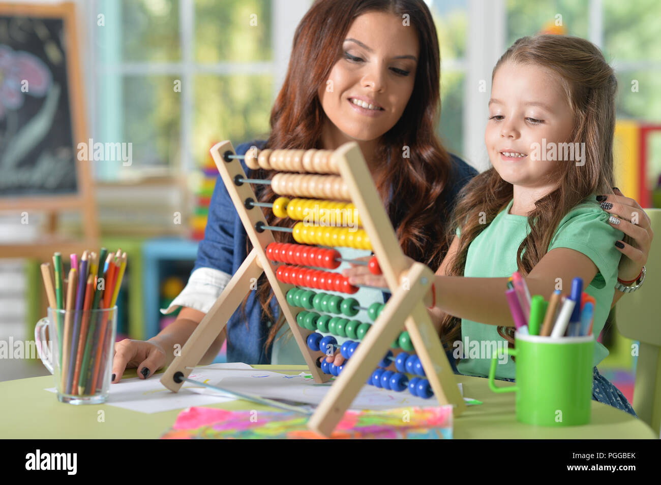 Portrait of a girl doing math exercises Stock Photo - Alamy