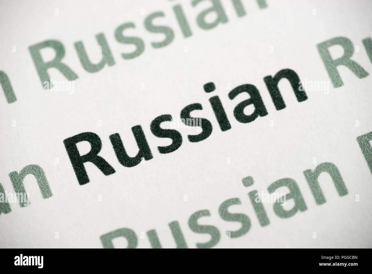 word Russian language printed on white paper macro Stock Photo - Alamy