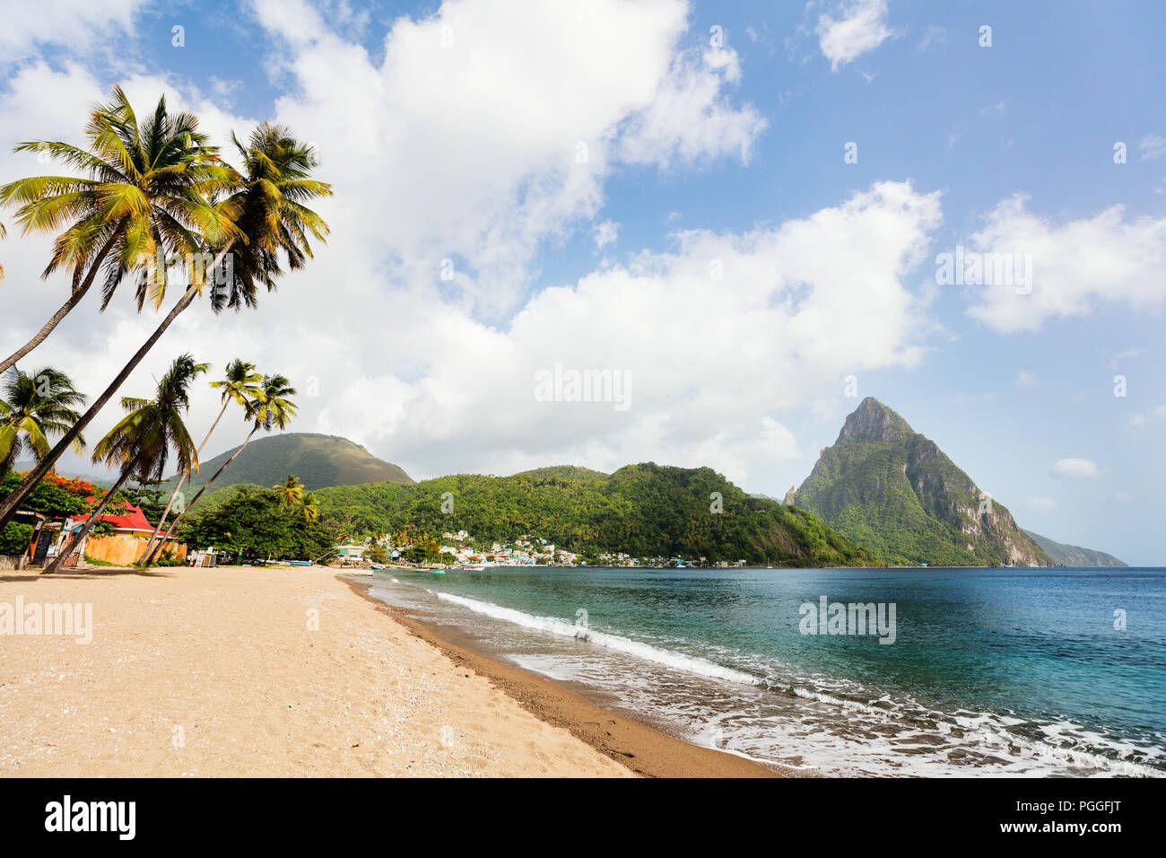 Idyllic white sand tropical beach with view to Piton mountains in Saint ...