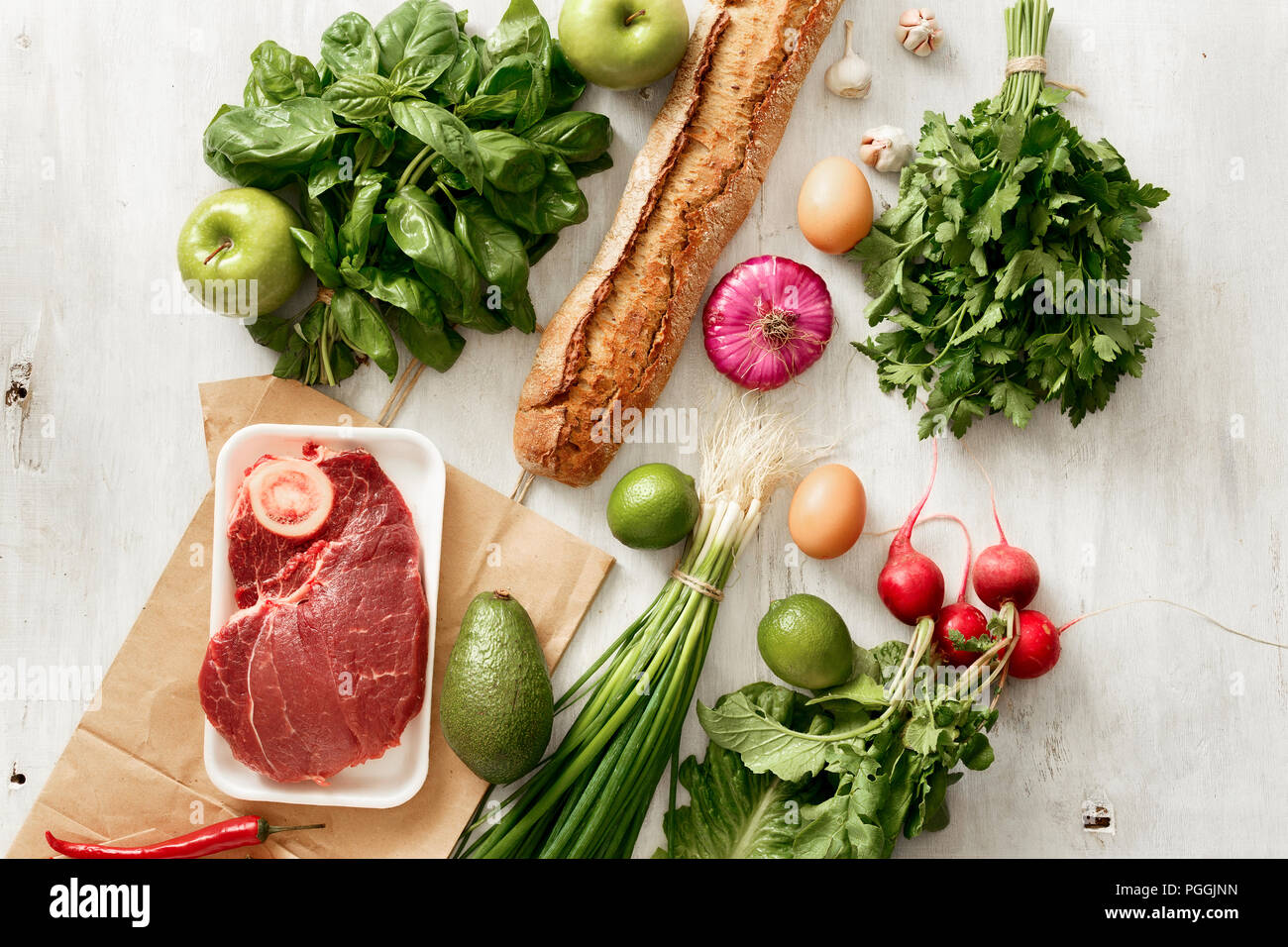 Top view set variety healthy food on white wooden table with paper bag ...