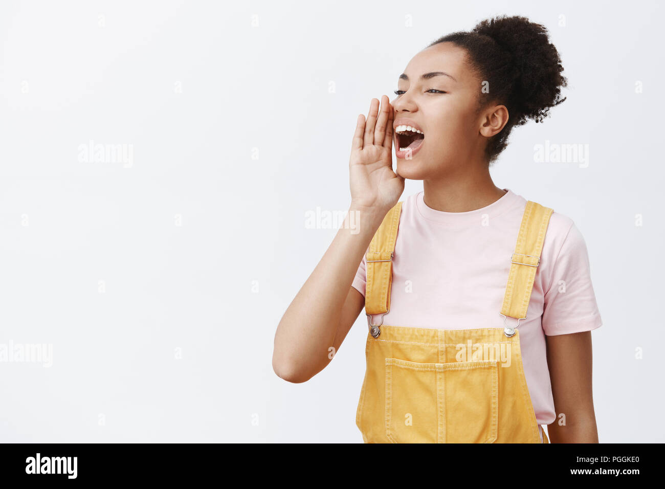 Girl shouting out loud to call friend come downstairs help her ...