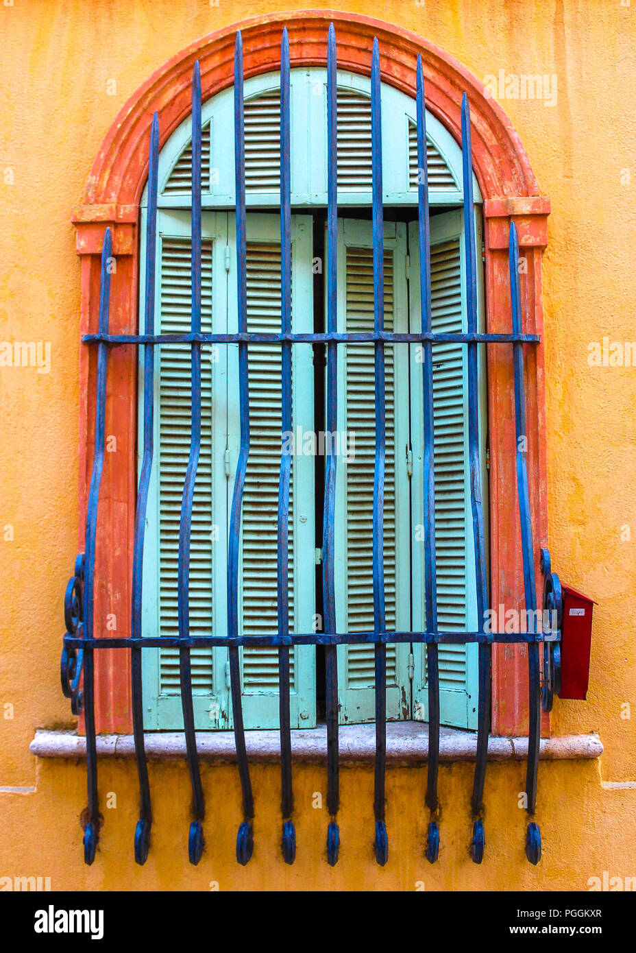 Ornate Arched Window with ornate bars Stock Photo - Alamy