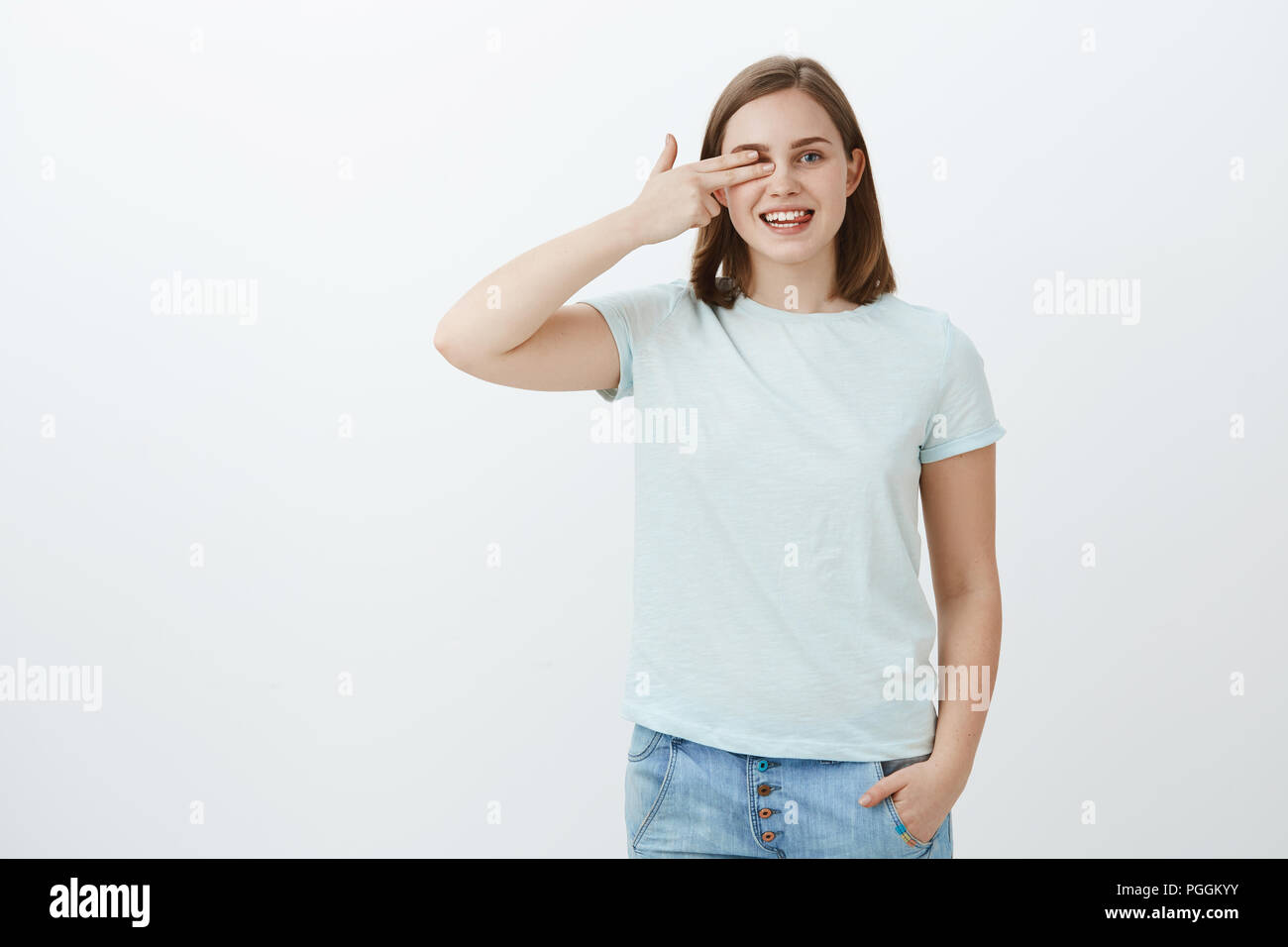 Reading words with one eye in optician store, picking new glasses ...