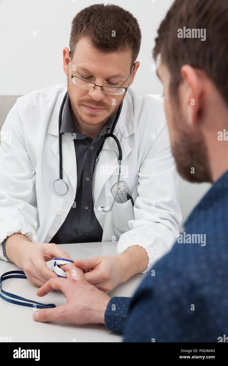 Measuring persons pulse oxygen saturation hi-res stock photography and ...