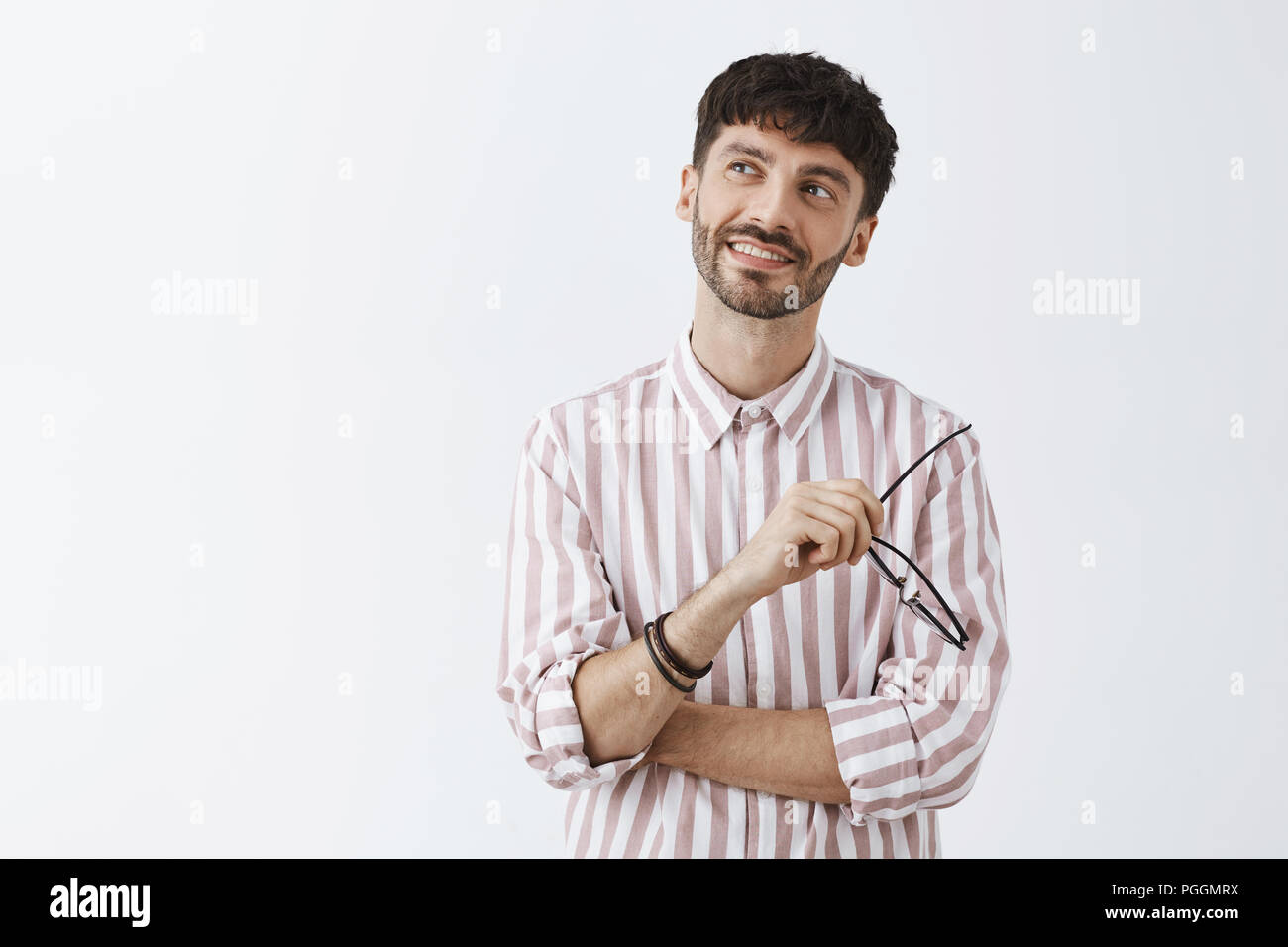 Dreamy Hopeful Attractive Caucasian Guy With Beard Tilting Head And