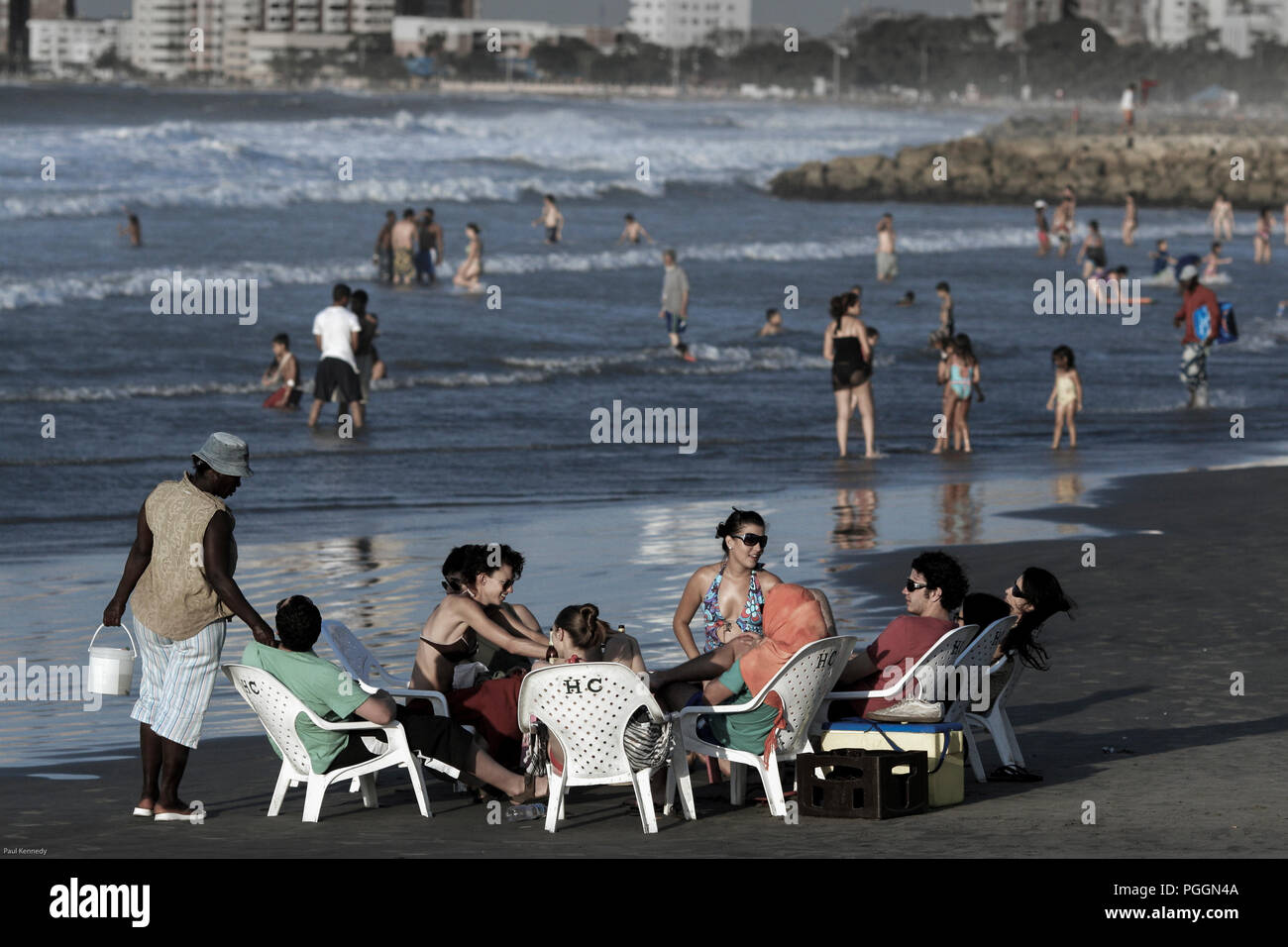 People enjoying Caribbean climate on beach at Santa Marta, Colombia ...
