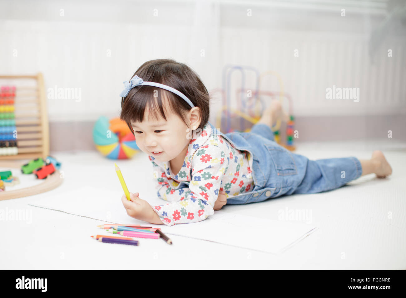 baby girl learning draw at home Stock Photo - Alamy