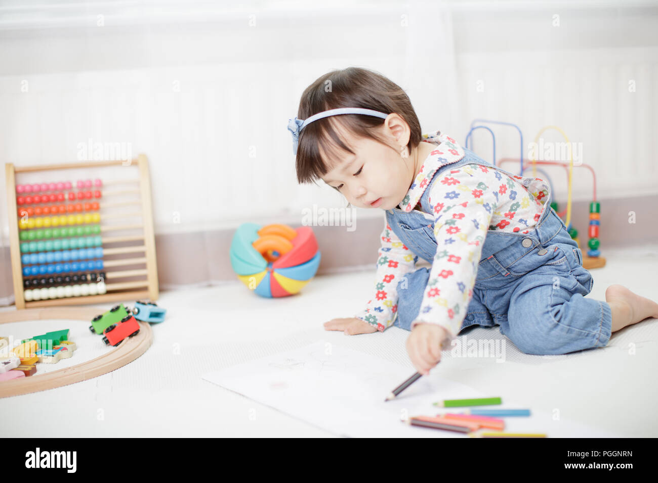 baby girl learning draw at home Stock Photo - Alamy