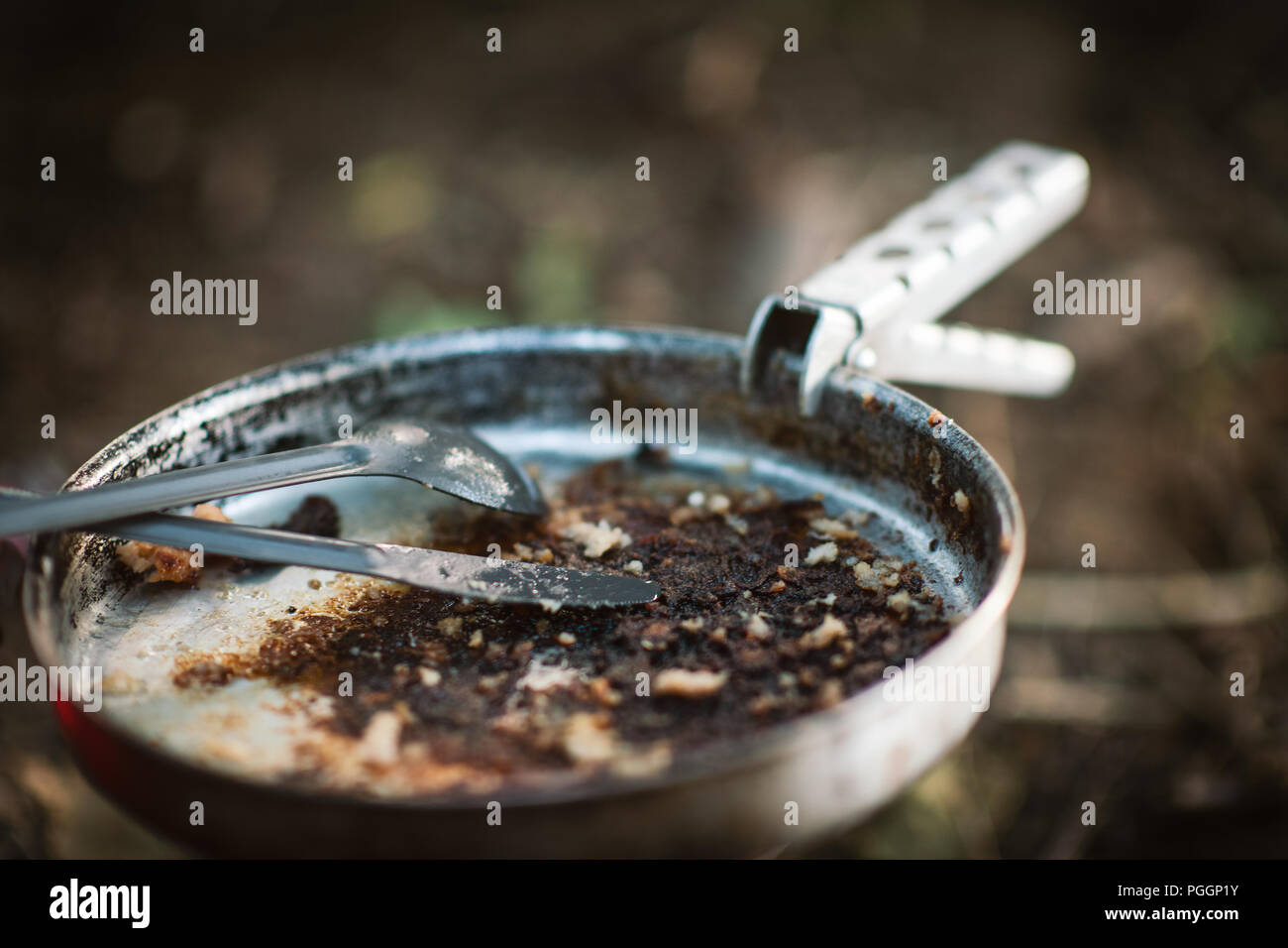 Camping stove with burnt food after cooking Stock Photo - Alamy