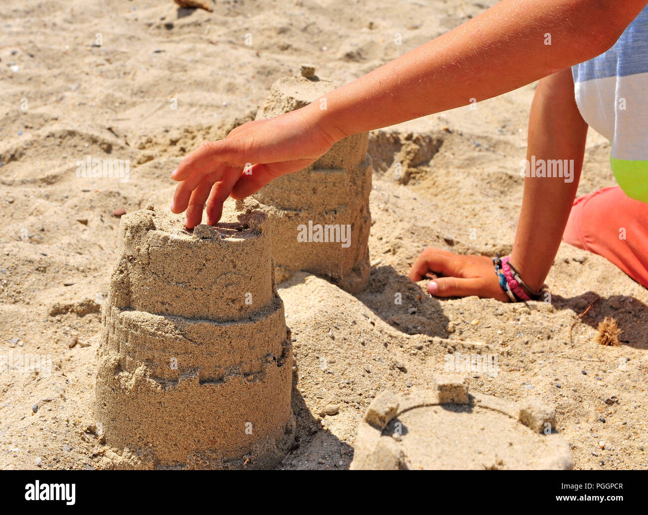 Boy building sandcastle on beach hi-res stock photography and images ...