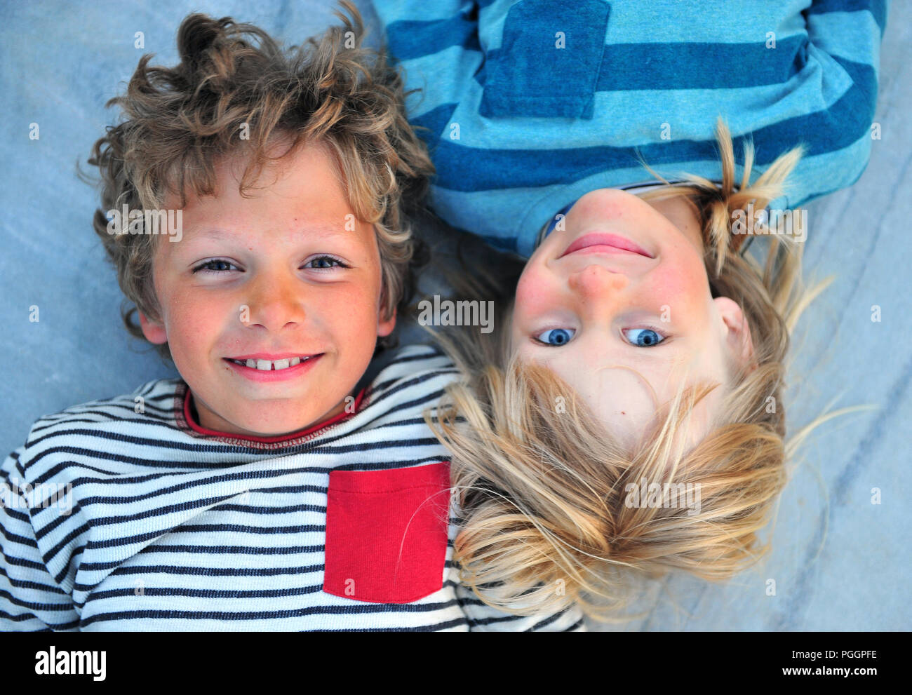 Portrait of two happy kids, top view Stock Photo - Alamy