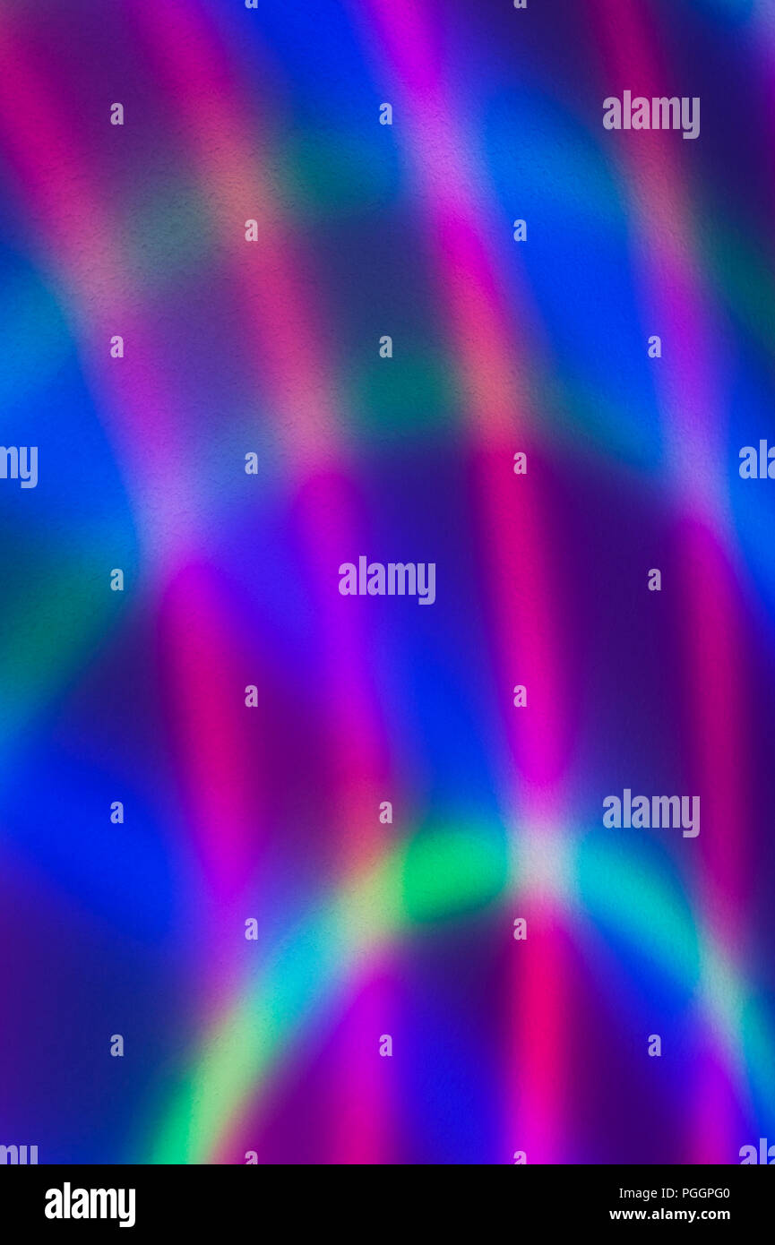Disco lights with multicolored light streaks of repeating colors and ...