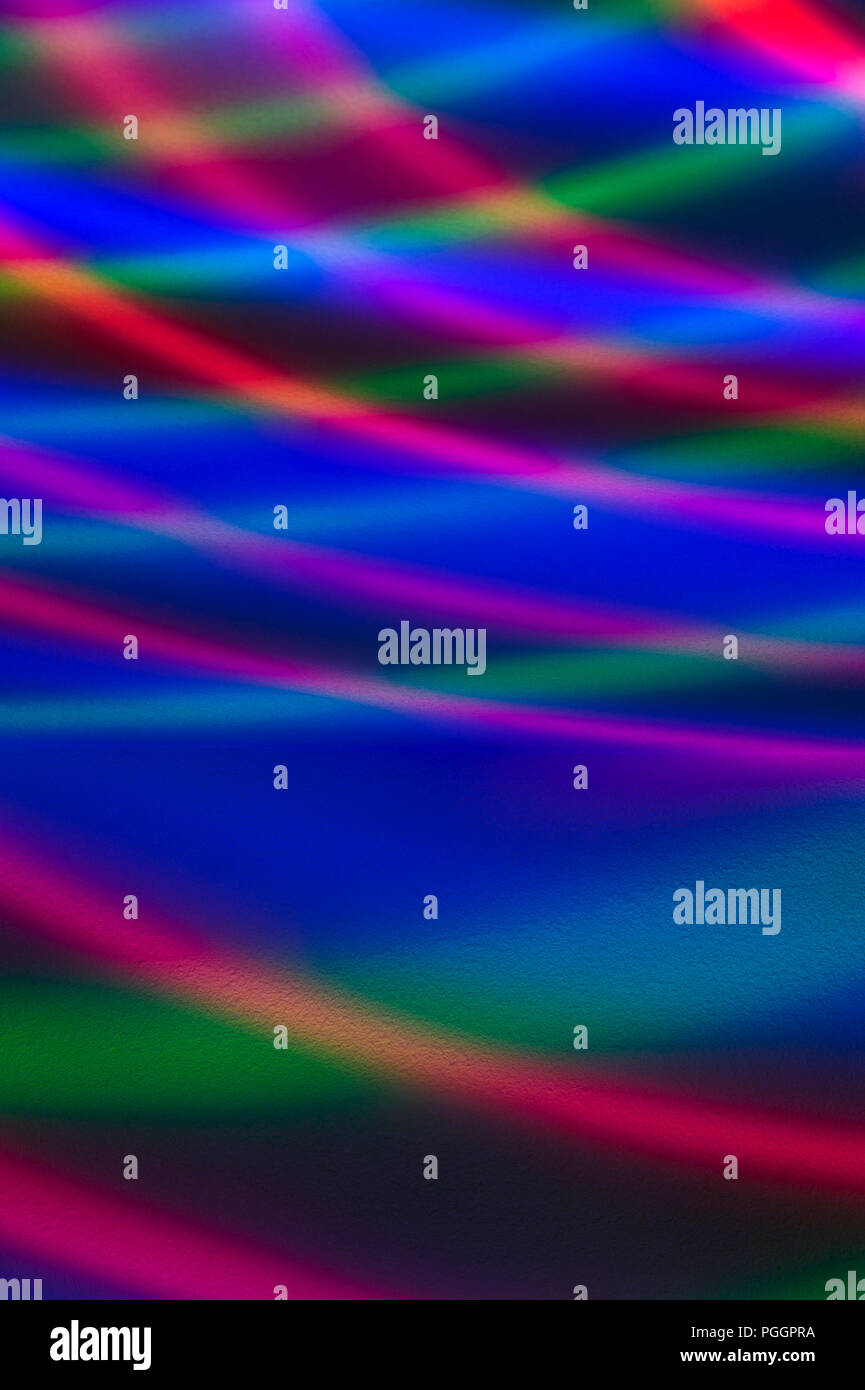 Disco lights with multicolored light streaks of repeating colors and ...