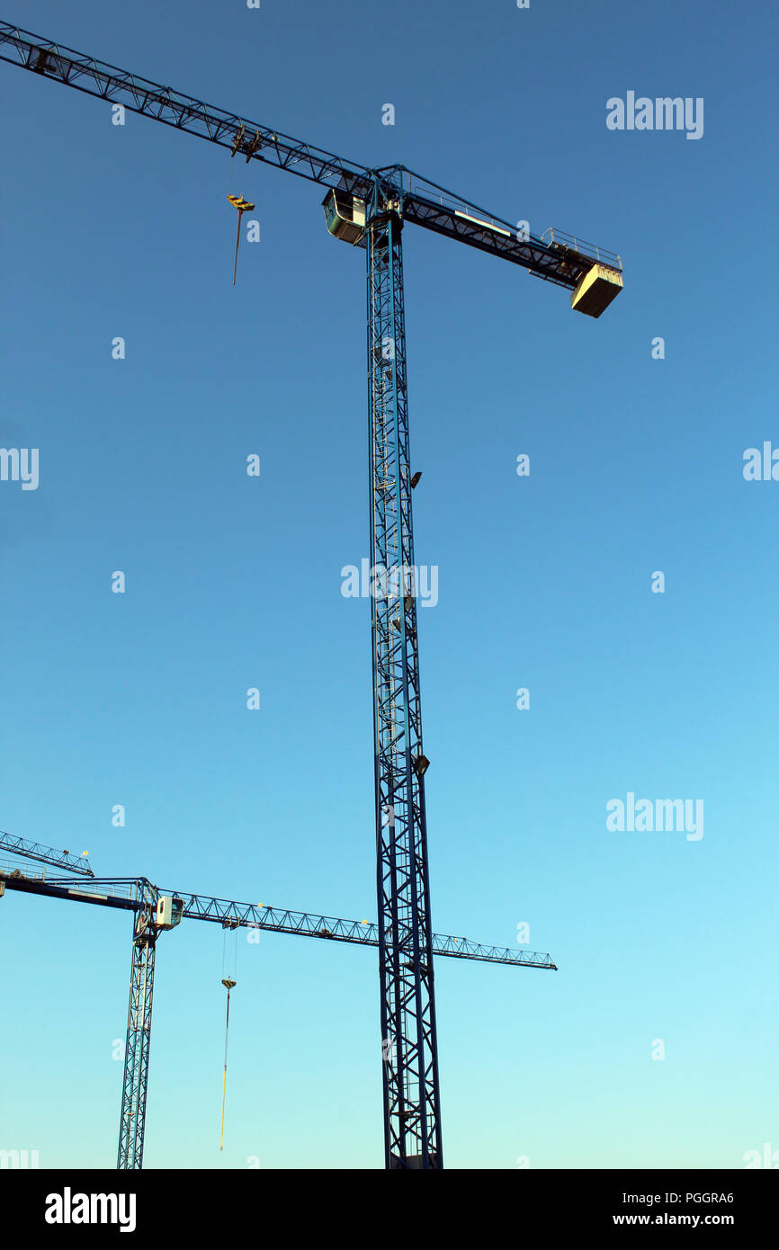 Large construction site including several cranes working on a building ...