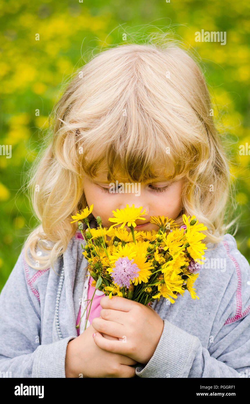 Portrait girl smelling yellow hi-res stock photography and images - Alamy