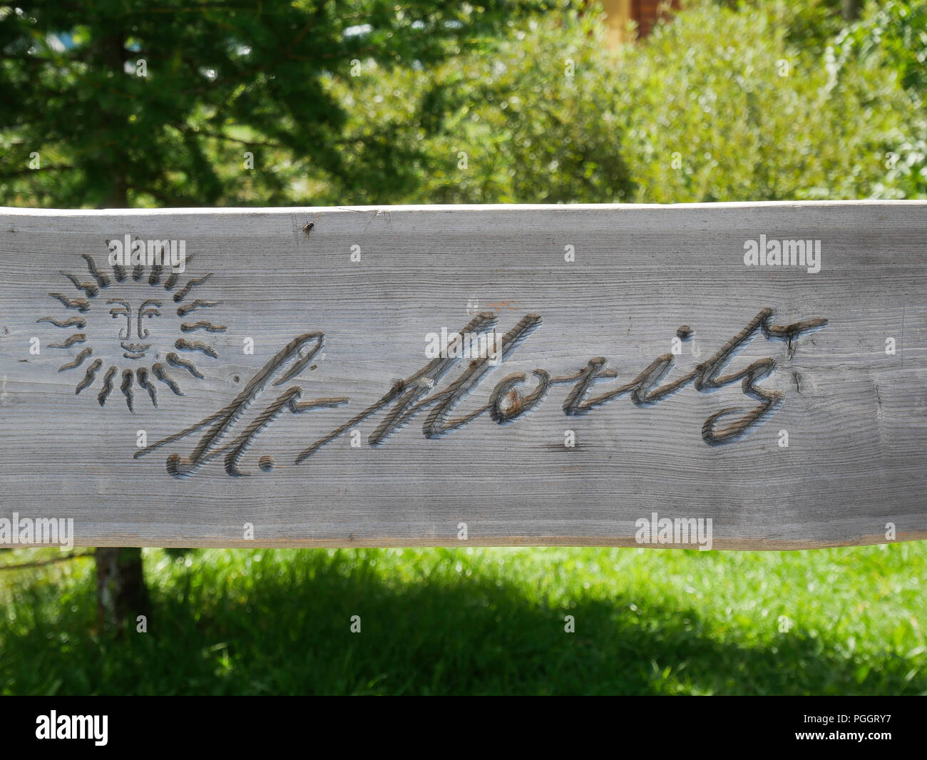wooden bench with the inscription "Saintz Moritz Stock Photo - Alamy
