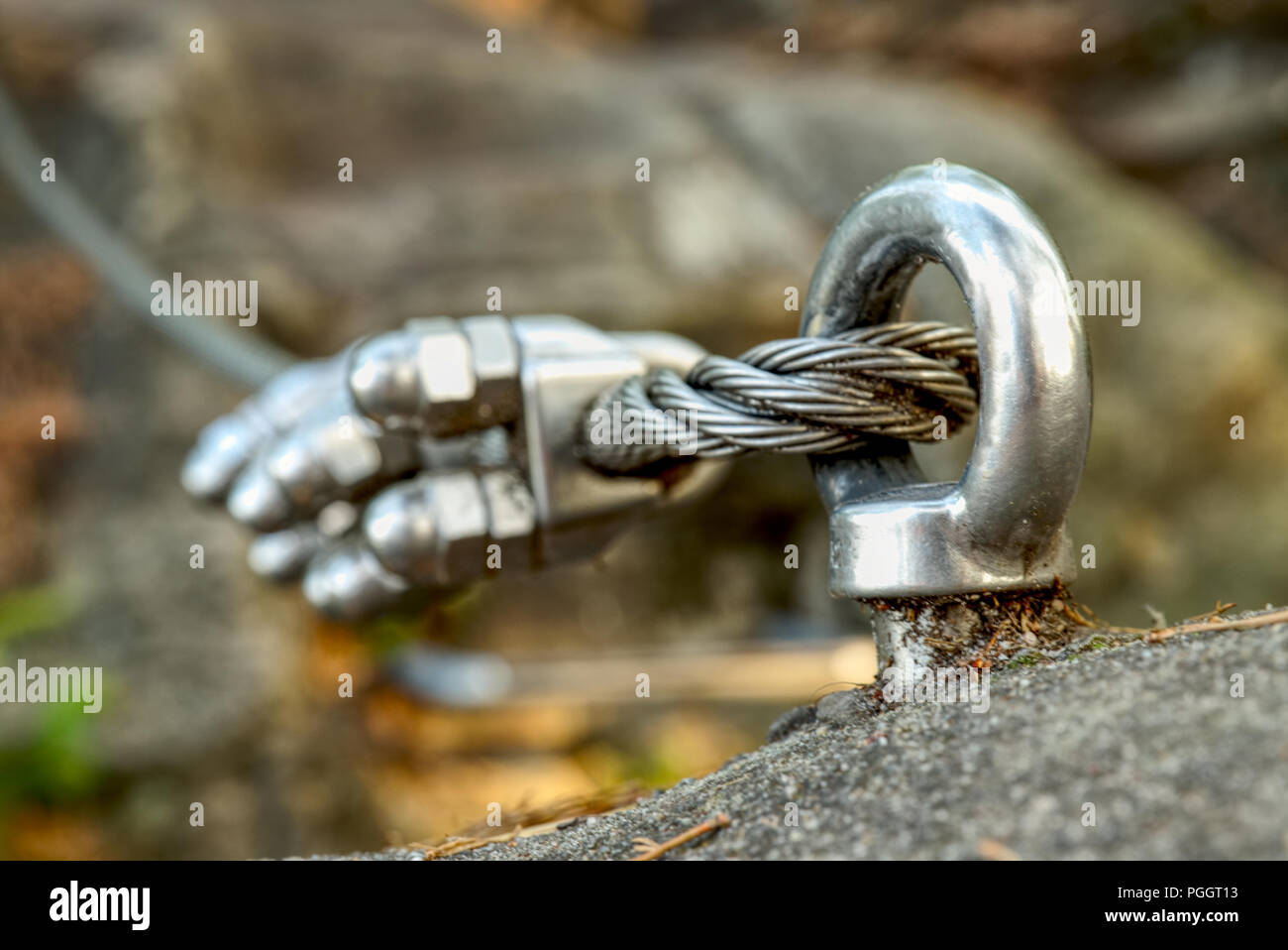 steel fixed rope for via ferrata. Climbing carabiner attached to the ...