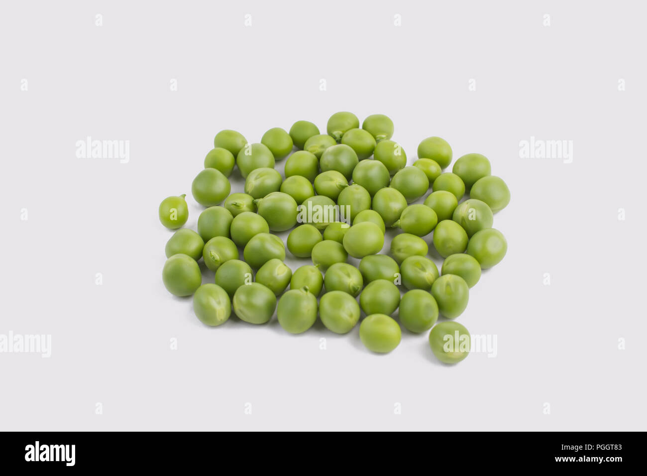 Pile of green wet pea. Isolated on white background Stock Photo - Alamy