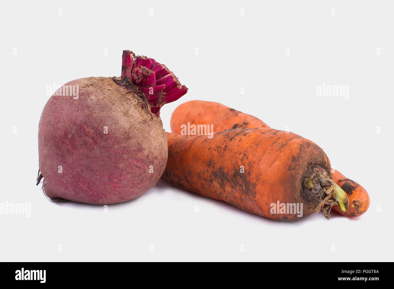 Beetroot and carrots, still life. Close up. White isolated background ...