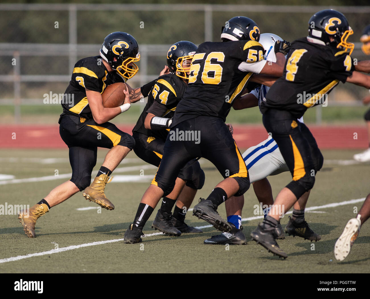 Football action with McQueen High School junior varsity at Enterprise ...