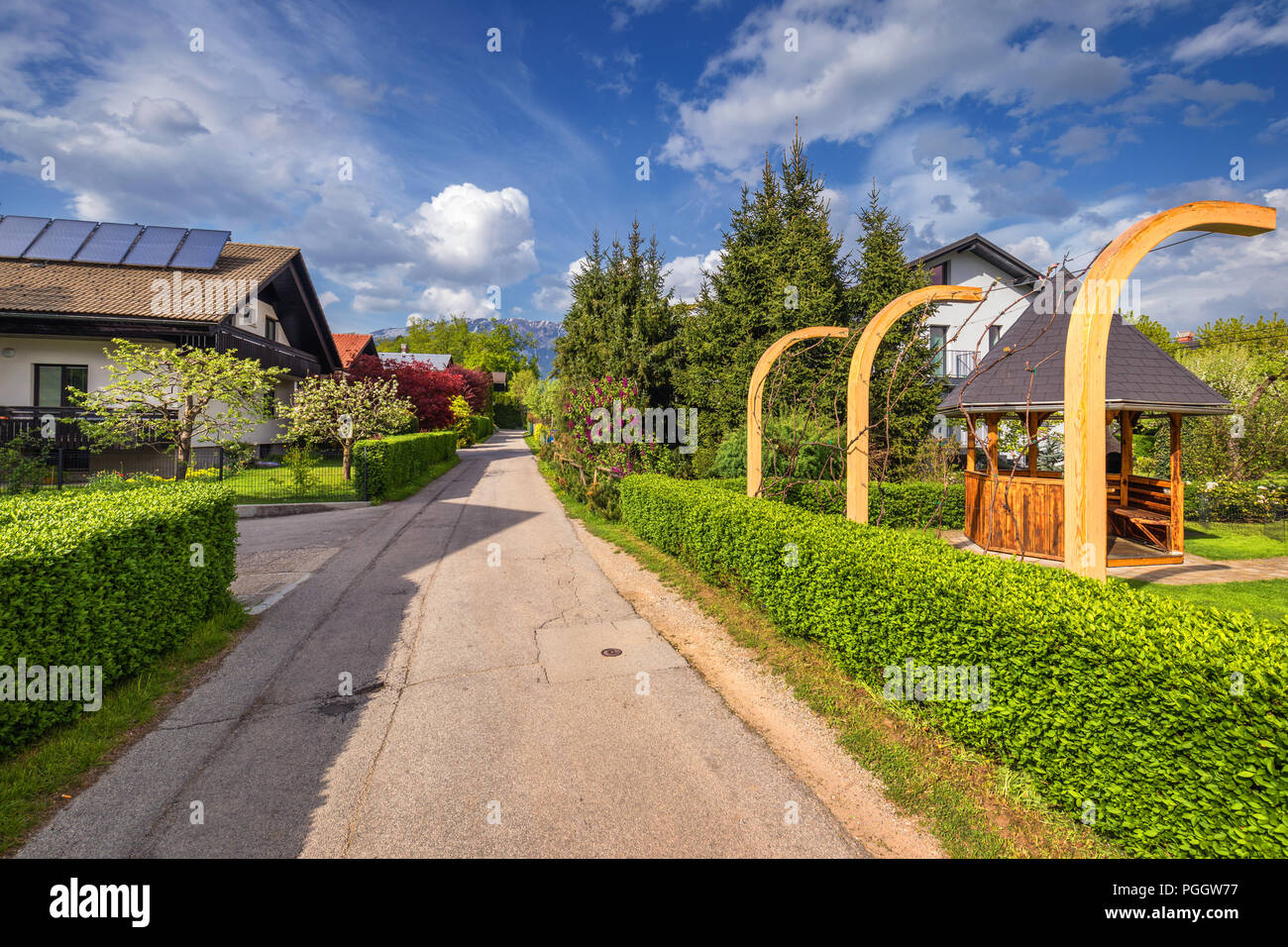 A quiet street with old traditional houses in alpine town, Bled ...
