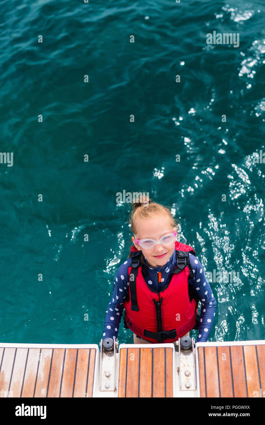 Adorable girl wearing life jacket at sea Stock Photo - Alamy