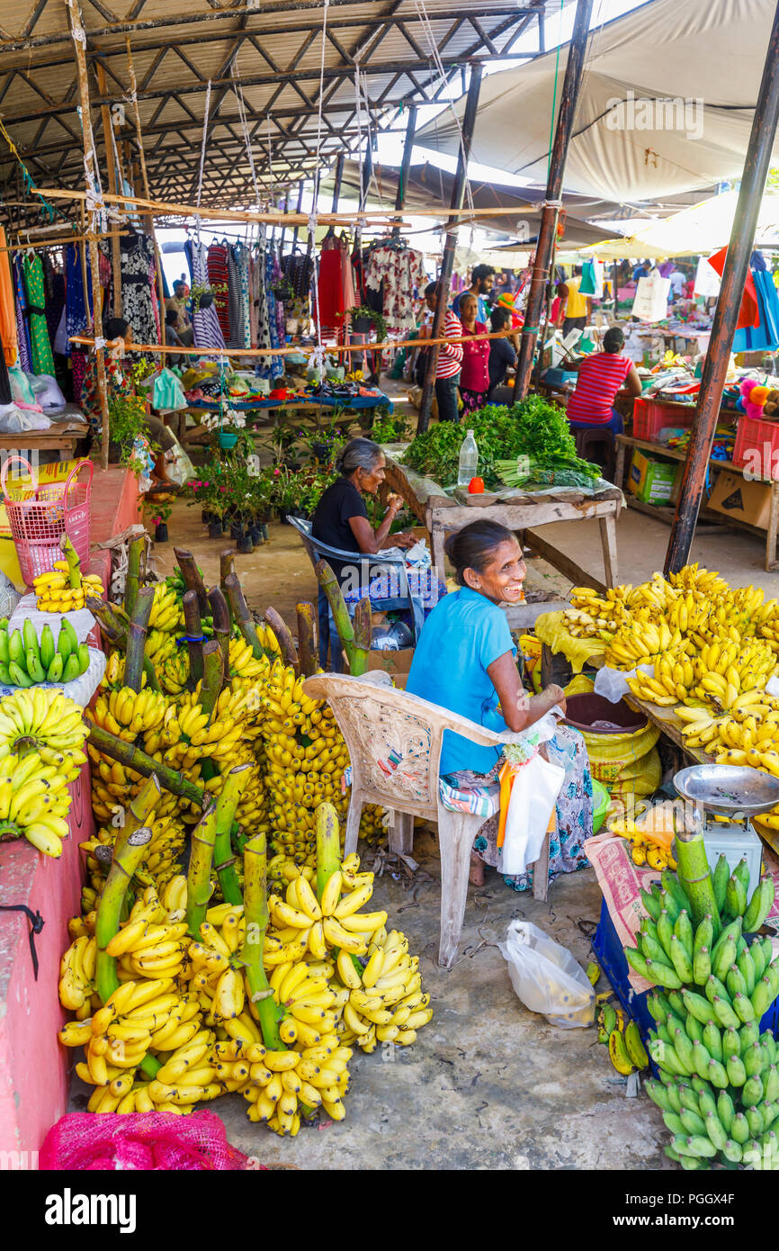 Woman shopping at local stall hi-res stock photography and images - Alamy