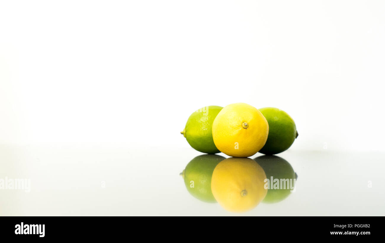 Lemon and lime with a gradient background Stock Photo - Alamy