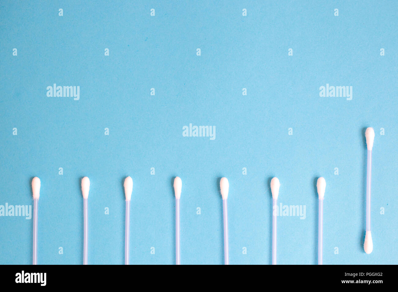 the pattern of the cotton buds on a blue background Stock Photo - Alamy