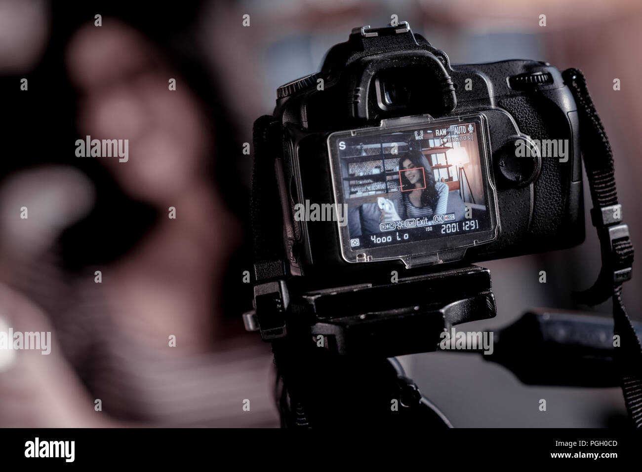 Inspired blogger making a video on her modern camcorder Stock Photo - Alamy