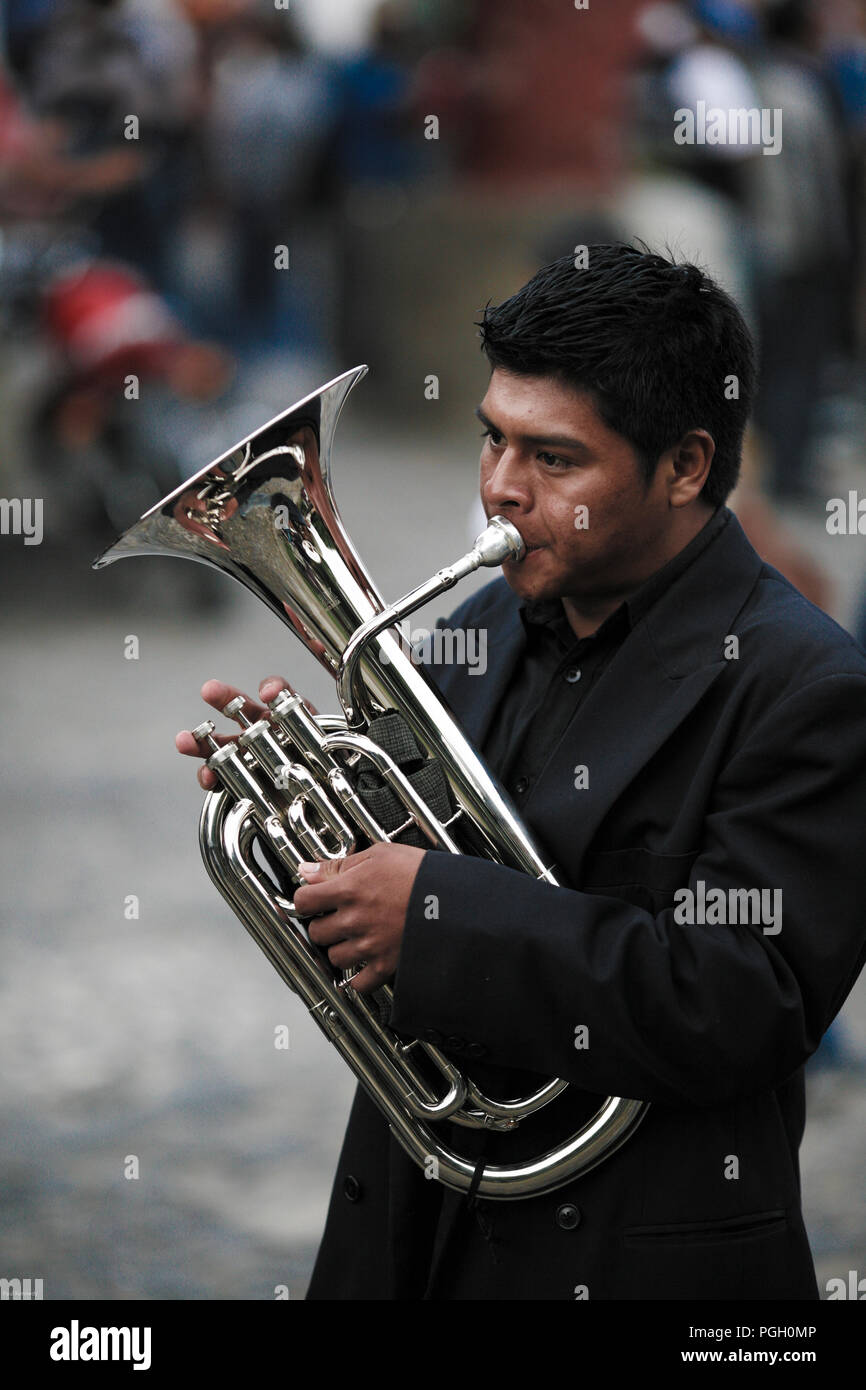 Man playing tuba brass instrument in the Plaza de Armas in Antigua ...