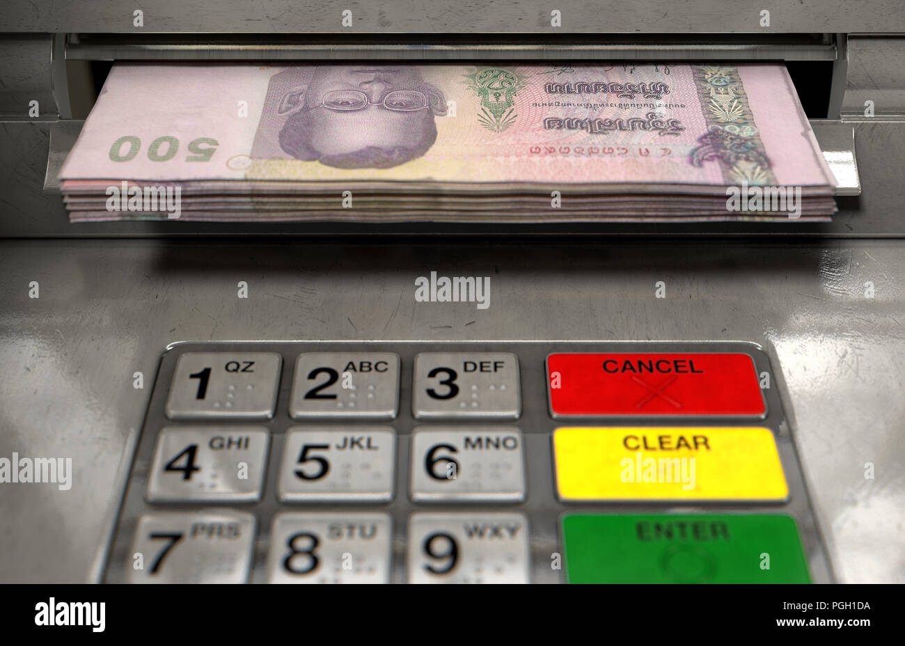 A closeup view of an atm facade with an illuminated sceen and keypad ...