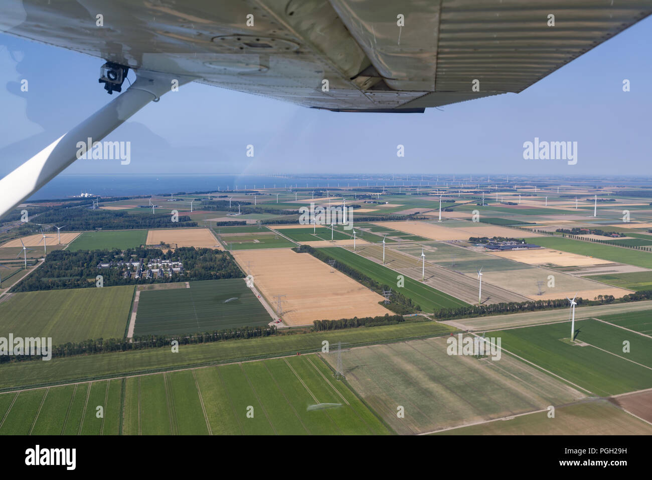 Aerial view Dutch landscape with farmland and wind turbines Stock Photo ...