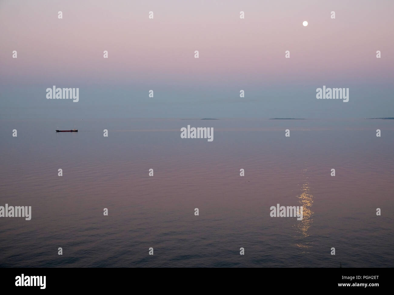 Full moon rising over the Copeland Islands, Belfast Lough Stock Photo ...