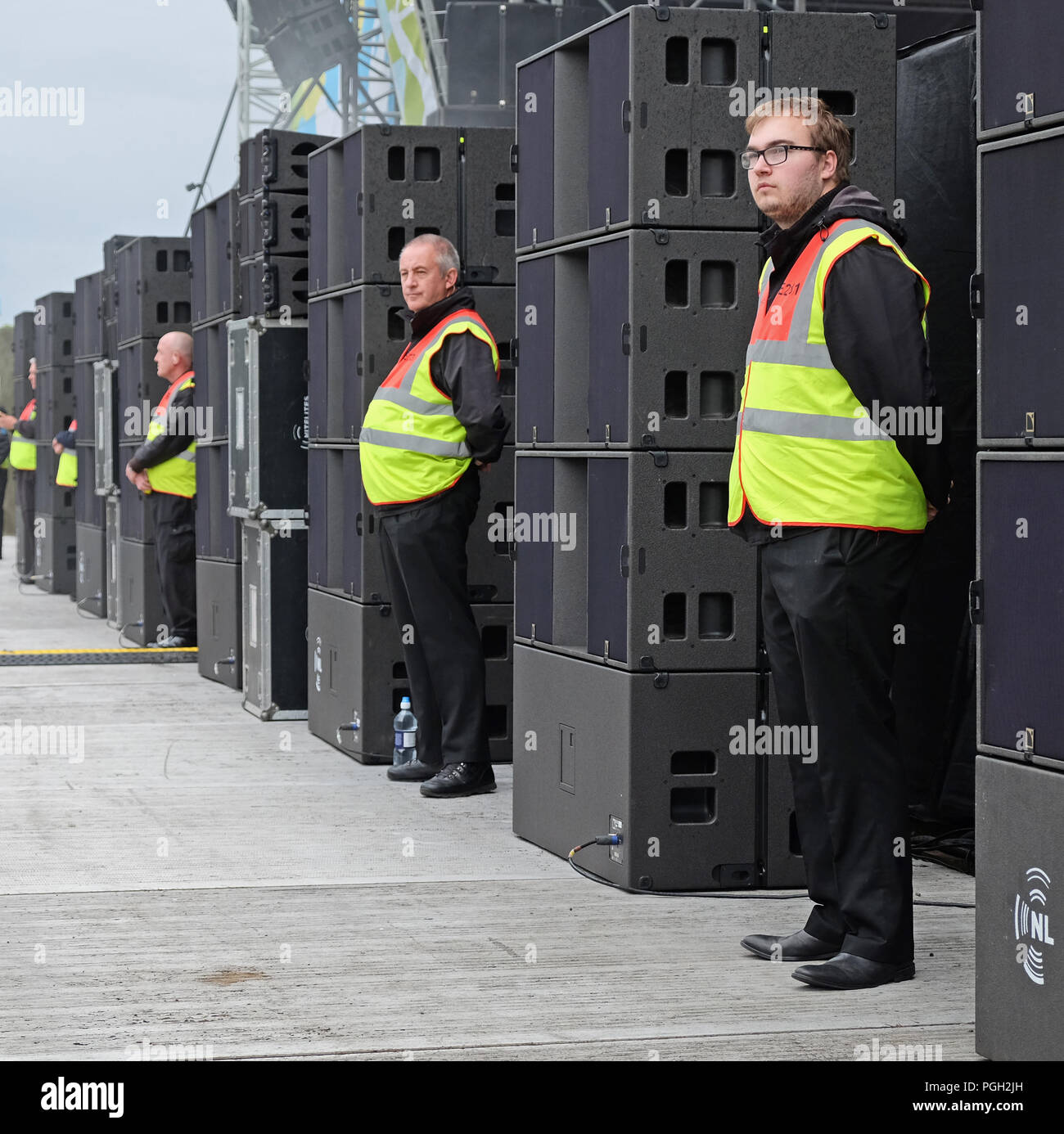 Security men standing between PA stacks at 'Belsonic', Ormeau Park ...
