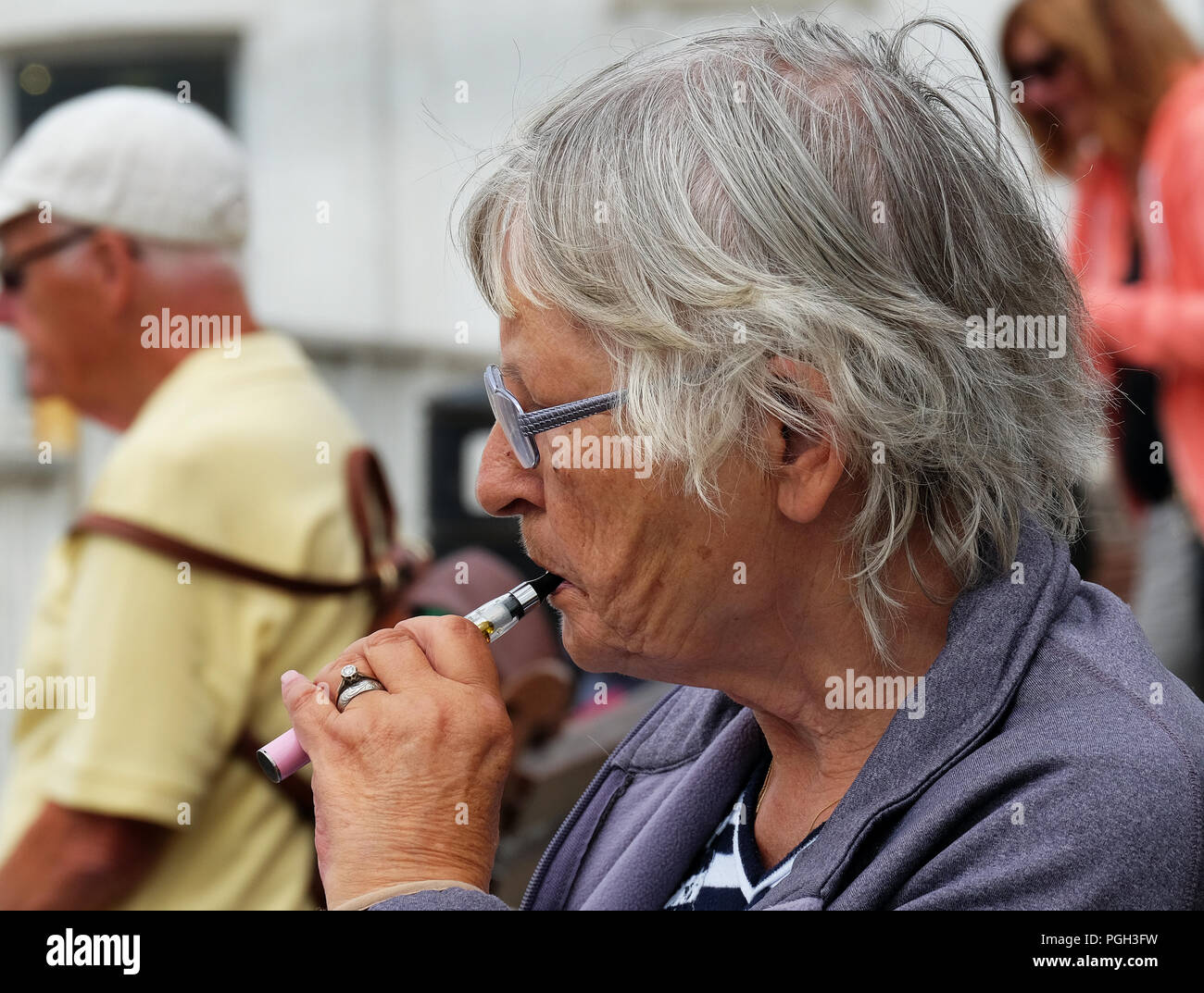 Using modern vape smoking device Stock Photo - Alamy