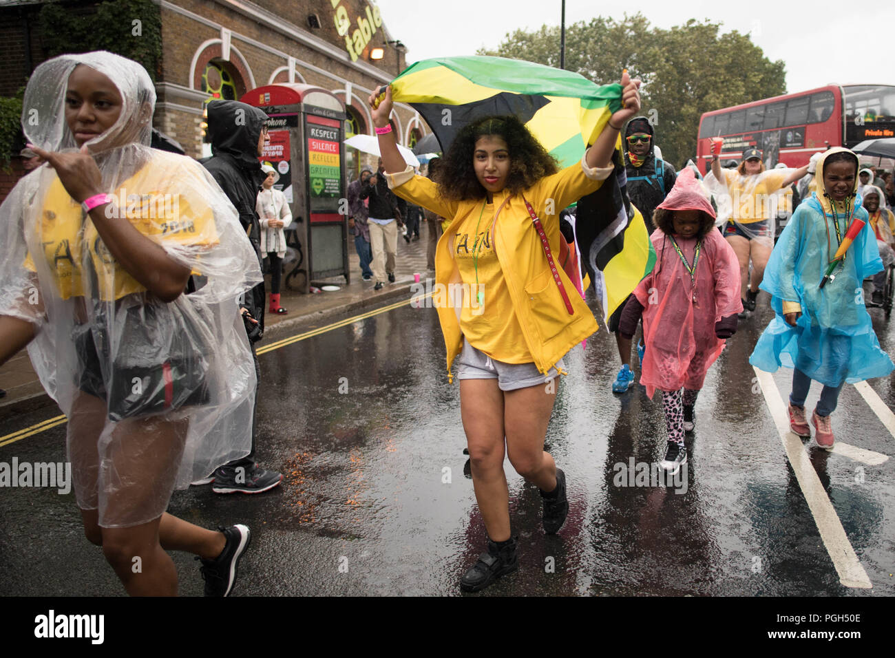 Dancers brave heavy rain during the Children's Day parade at the ...