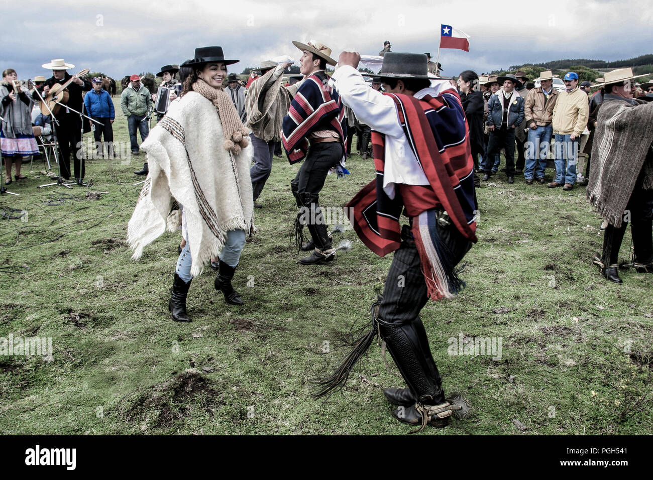 People dancing the cueca outside at a cabalgata in Cobquecura, Biobio ...