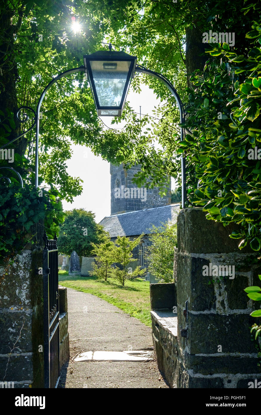 Mullion village on the Lizard Peninsula Cornwall UK St Melanus church ...