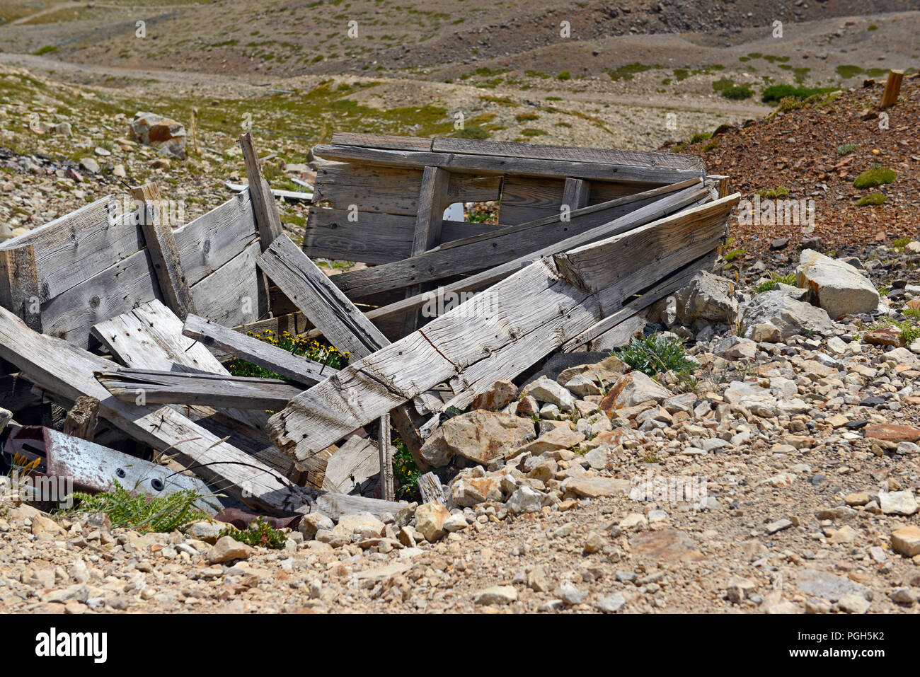 Remains of old mine and vintage mining log cabin in the mountains in ...