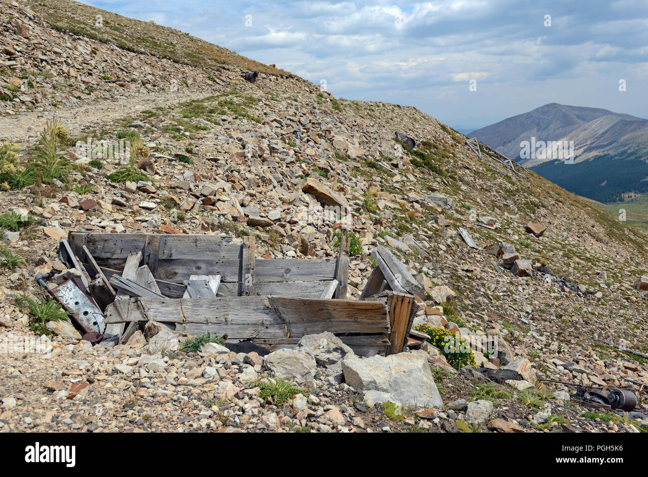 Remains of old mine and vintage mining log cabin in the mountains in ...