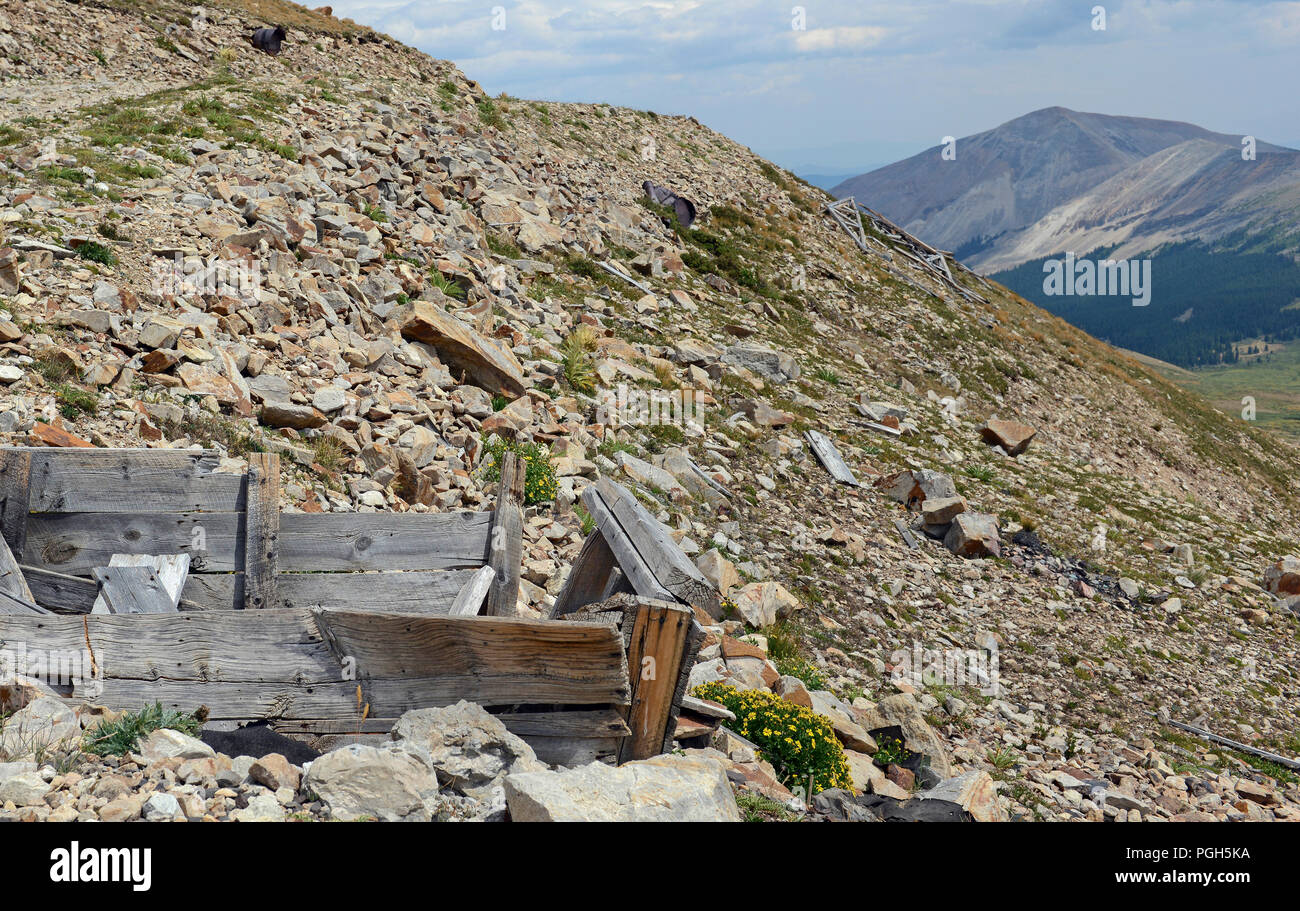 Remains of old mine and vintage mining log cabin in the mountains in ...