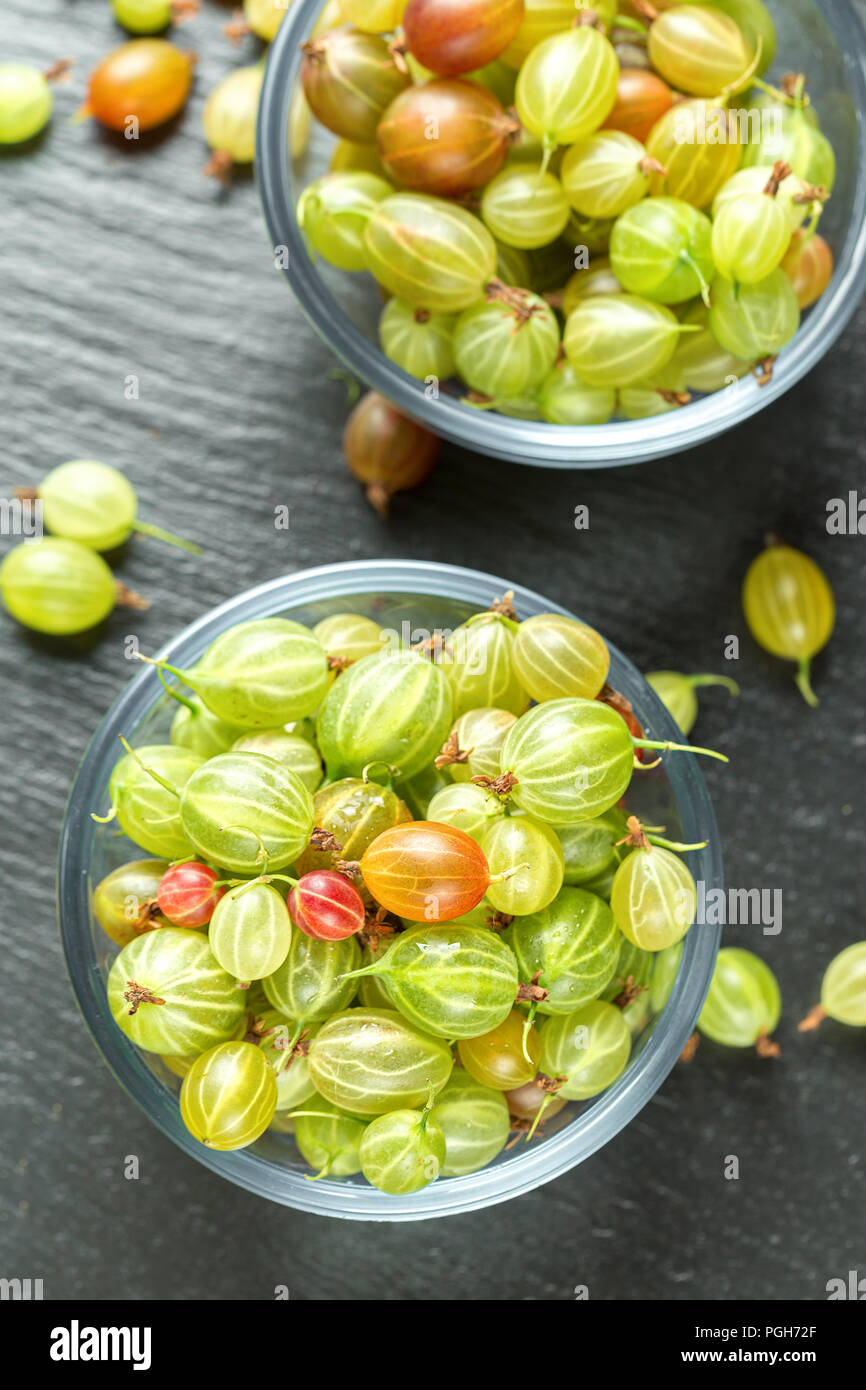 Gooseberries in a glass plate, preparation for preparation of berry ...