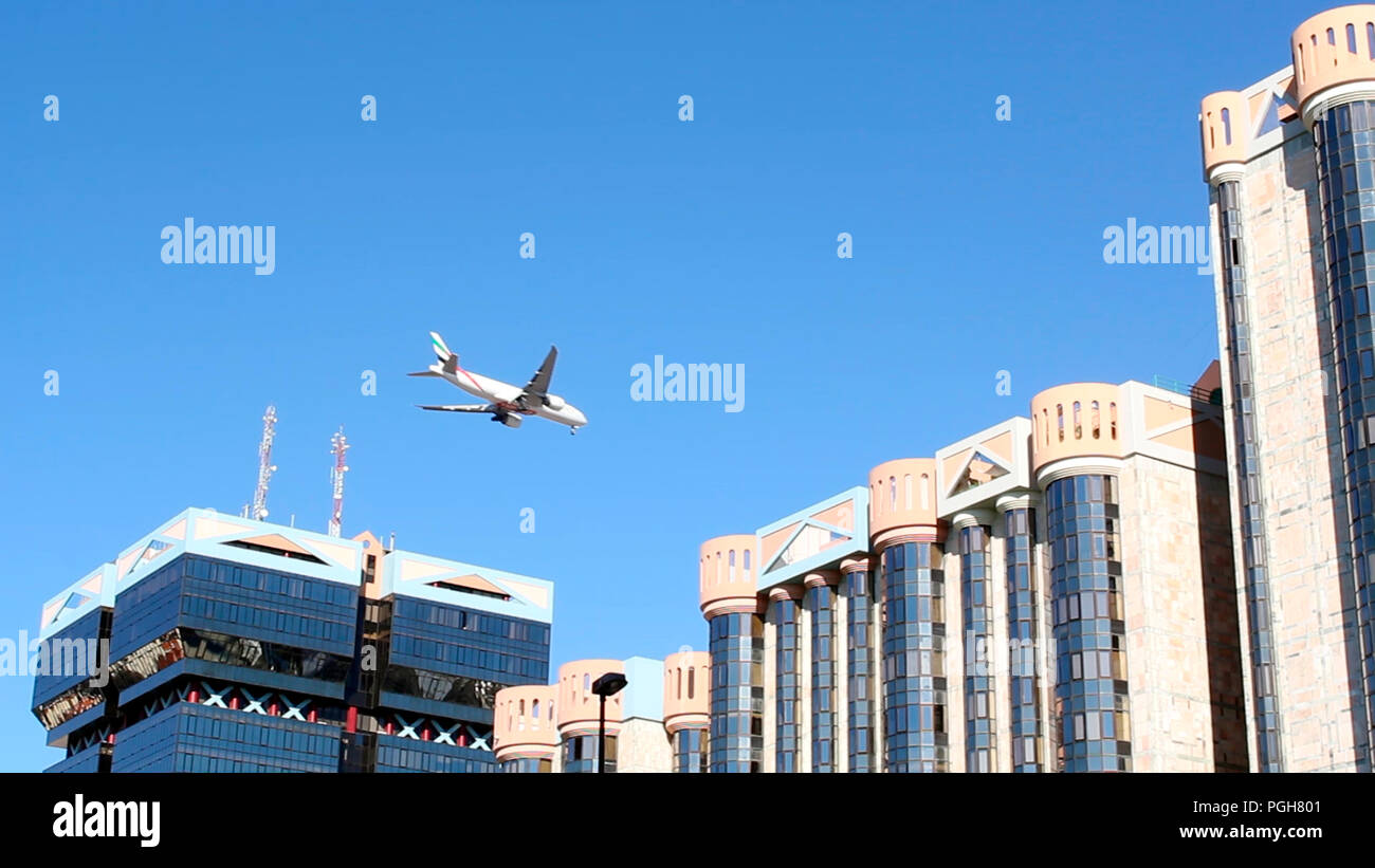 Commercial jet plane over city hi-res stock photography and images - Alamy