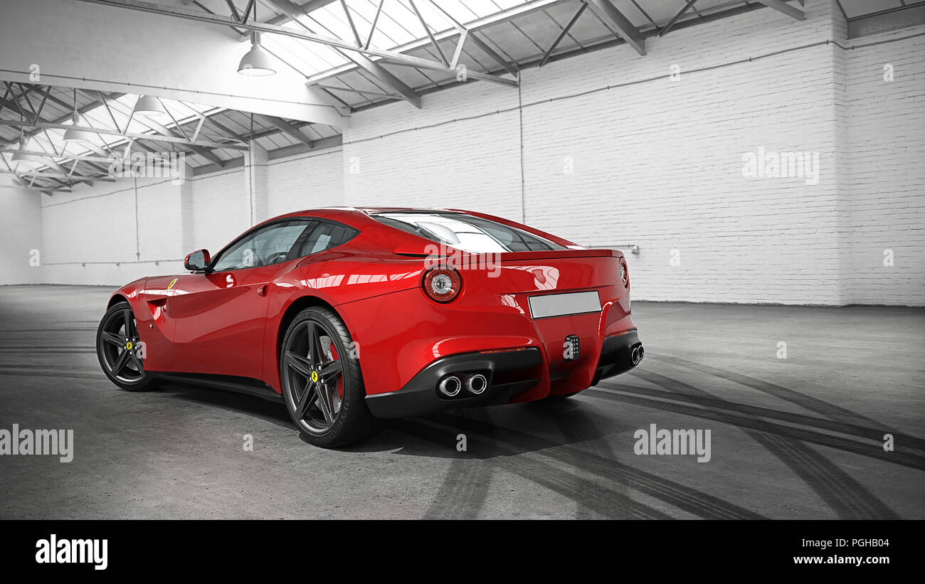 Modern red car in the garage. 3D rendering. Rear view Stock Photo - Alamy