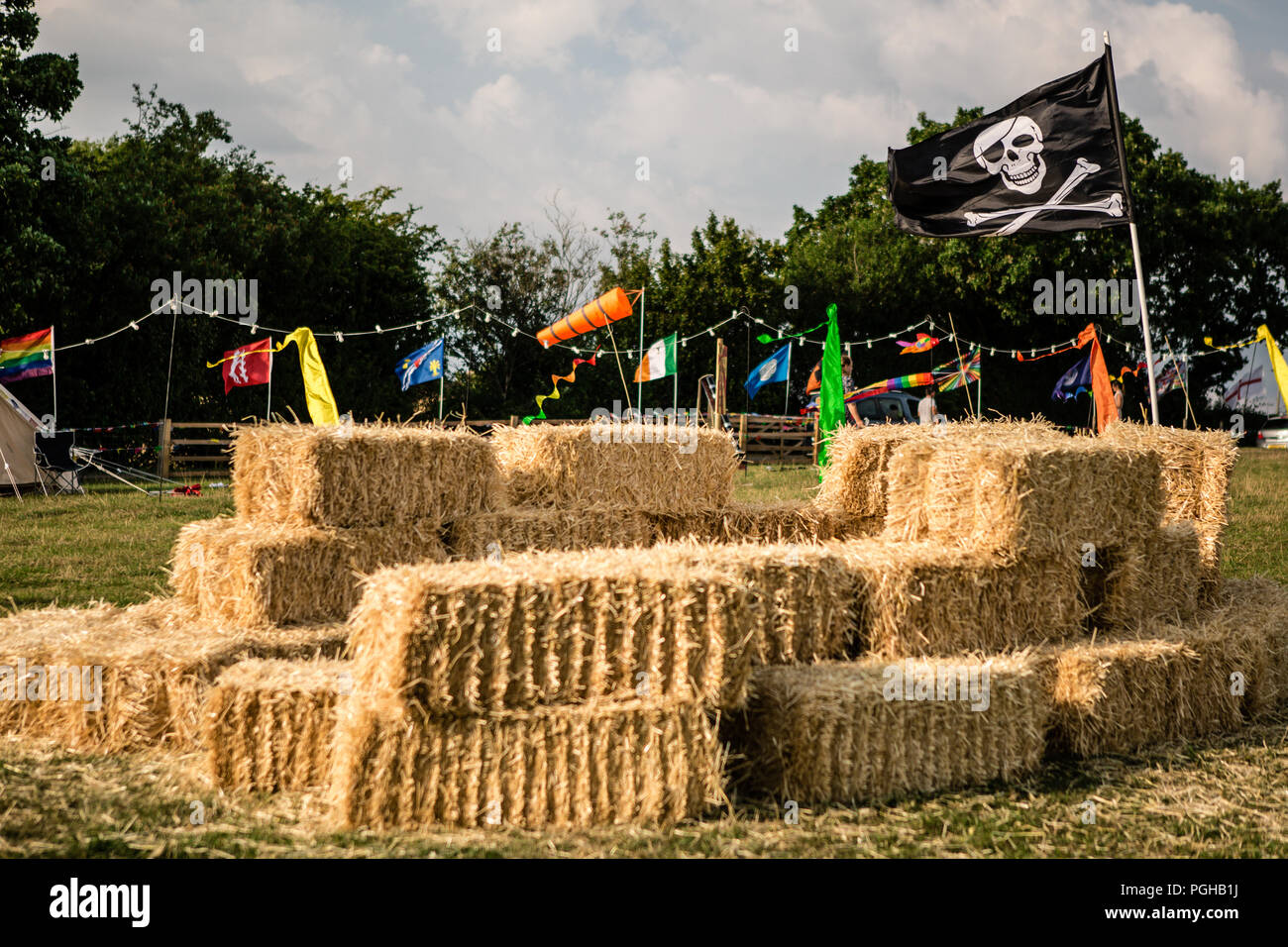 Large kids pirate ship on farm / field built from hat bales, flying ...