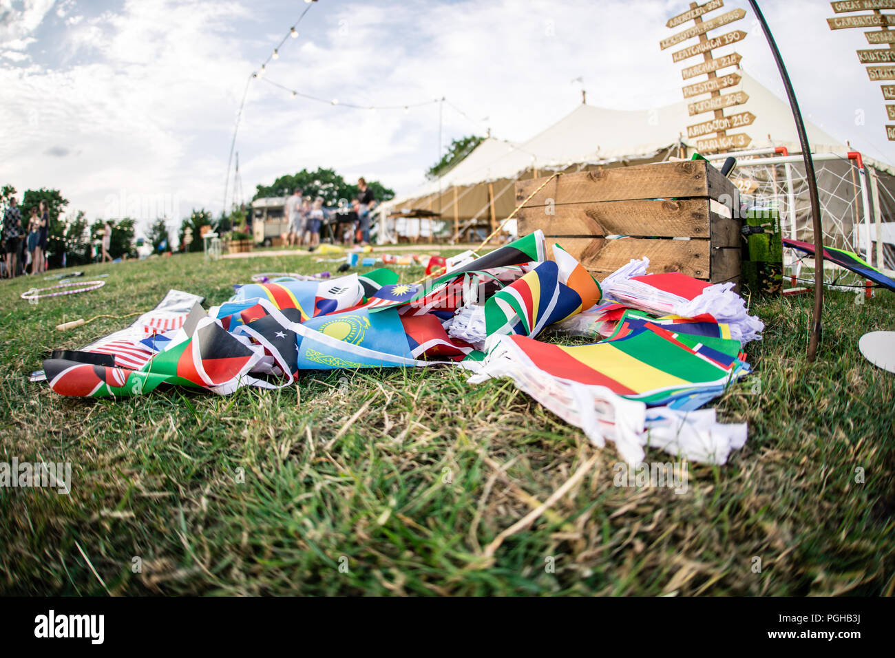 Pile of colourful flags from many nationalities on floor outside ...