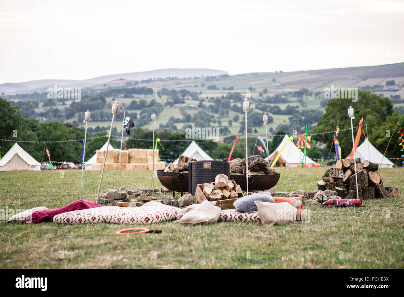 Communal fire pit / seating area at festival campsite Stock Photo - Alamy