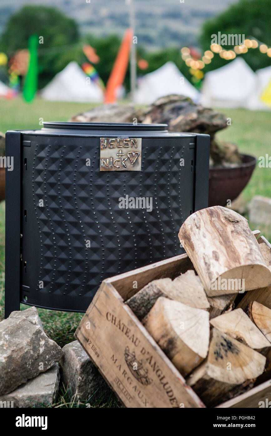Communal fire pit / seating area at festival campsite Stock Photo - Alamy
